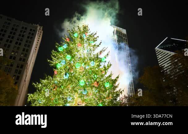 Chicago Christmas Tree lighting in downtown with fireworks. Wide shot ...
