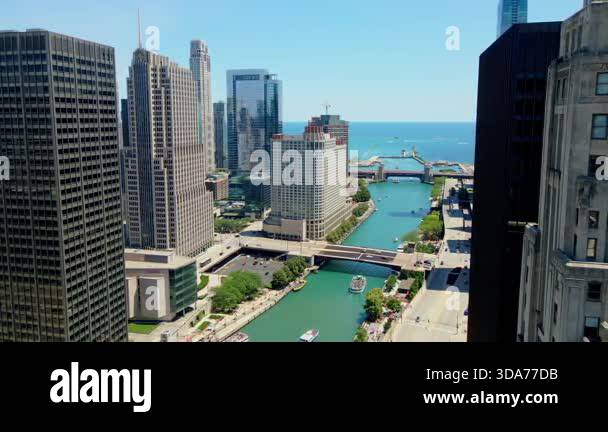 Chicago river in downtown, with bridges and high raised buildings on ...