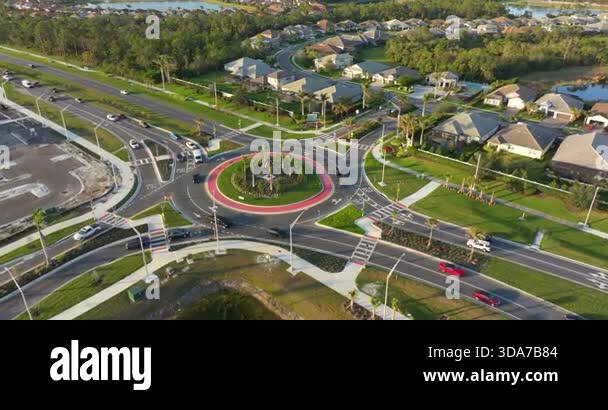 Traffic circle on American road with driving cars. Overhead view of US ...