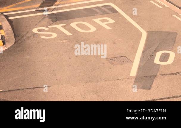 Top view of asphalt road markings with left stop lane, right out lane ...