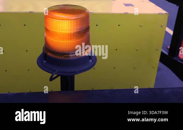 An amber warning light equipped with a rapidly rotating flasher ...