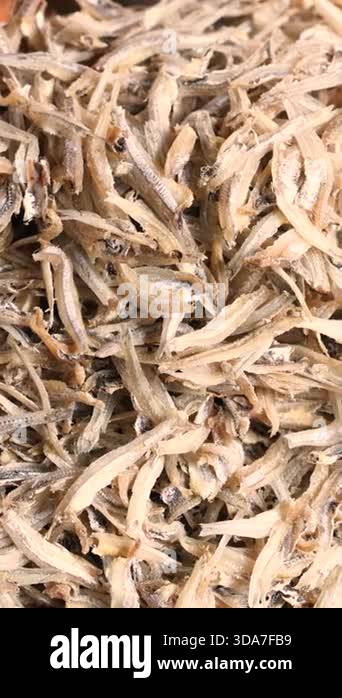 Small dried fish like anchovies served as snack or used in soups ...