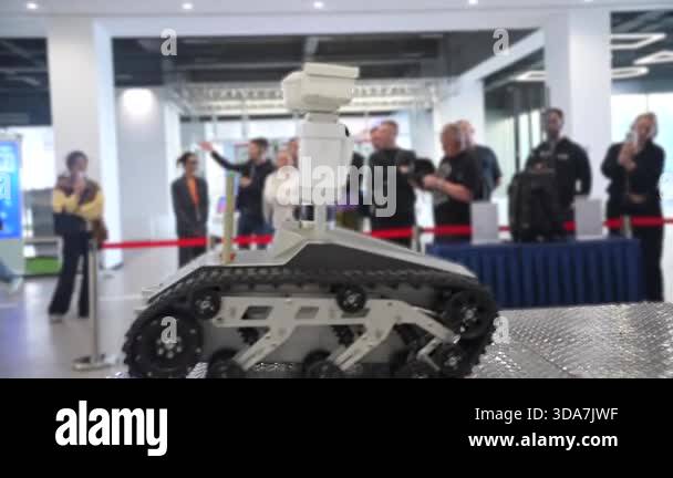 Small reconnaissance robot with caterpillar tracks performing a ...