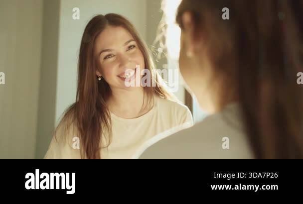 White mother speaking warmly to daughter sunlight backlight expressive ...