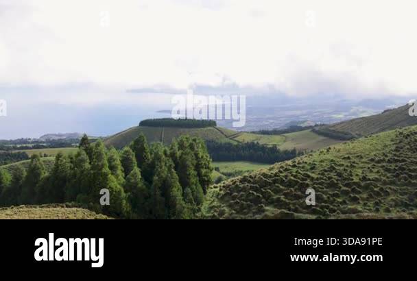 A beautiful landscape with a large hill and the Atlantic Ocean in the ...