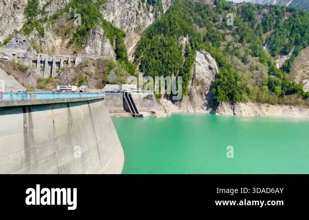 Kurobe Dam and Lake Kurobe beside the Tateyama Kurobe Alpine Trail. The ...