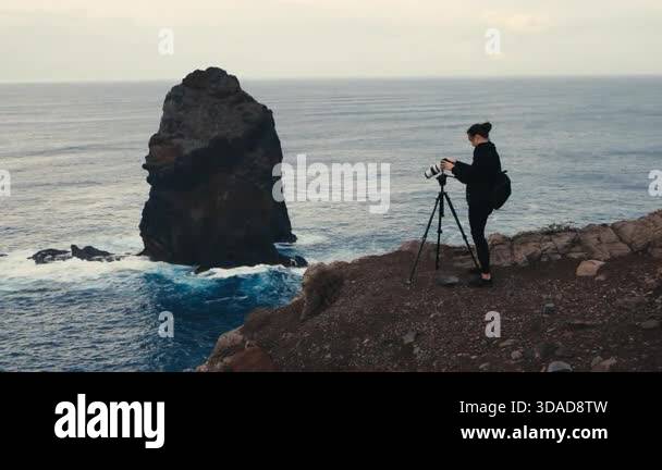 Person photographing rocky coastline near ocean Stock Video Footage - Alamy