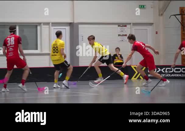 Valmiera, Latvia - December 03, 2025: Dynamic floorball scene featuring ...