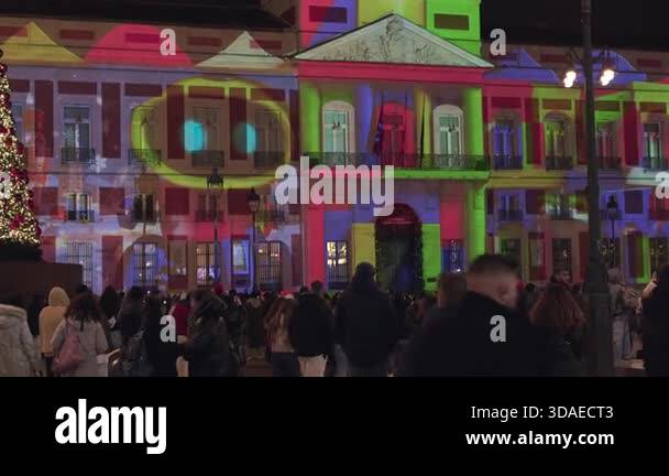 Madrid, Spain, 12/02/2025: Crowd watching a colorful video mapping ...