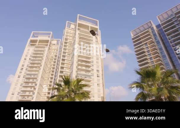 Panoramic shot of high-rise buildings in city on the blue sky ...