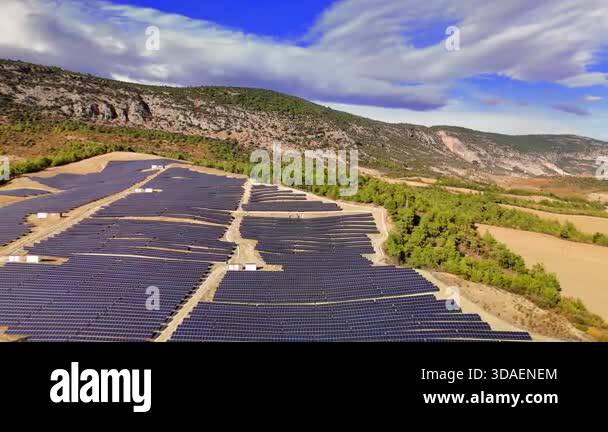 Birds eye view of a sprawling solar farm with endless rows of solar ...