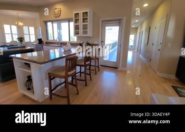 Cozy Lounge With Fireplace And Adjoining Kitchen Island, Bar Stools And ...