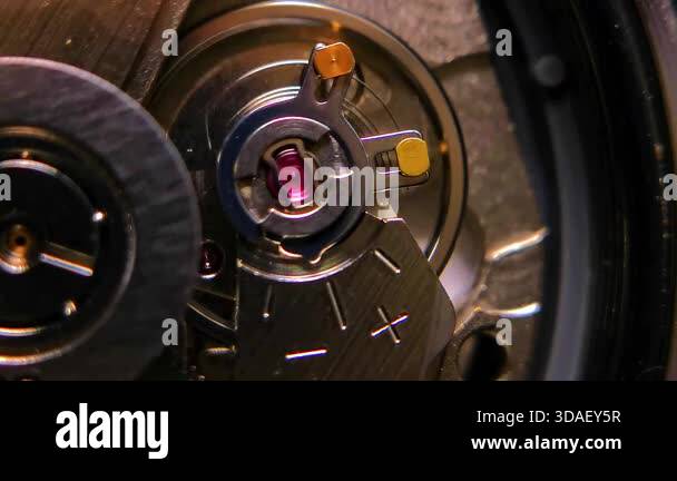 Detailed macro footage of an automatic watch escapement, highlighting ...