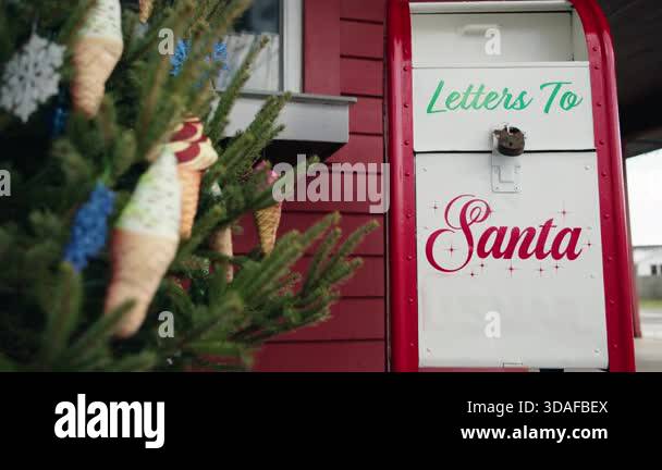 Christmas mailbox for letters to Santa next to a decorated holiday tree ...