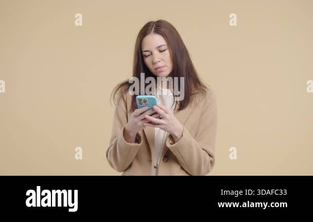 Modern businesswoman in formal blazer scrolling phone with tired sigh ...