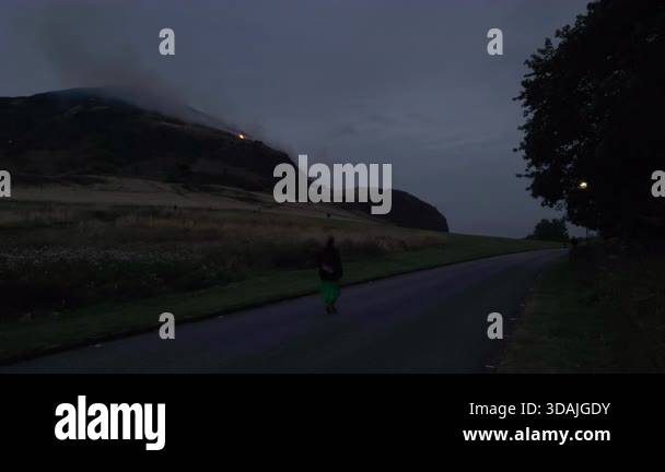 EDINBURGH, SCOTLAND, UK - AUGUST 10, 2025: A fire is visible on Arthurs ...