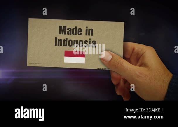 Made in Indonesia box in hands. Indonesian export import Cardboard pack ...
