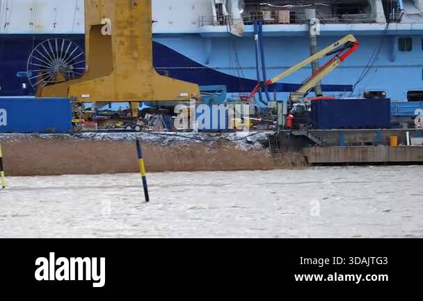 4K video showing the construction of a large ship at sea, filmed from a ...