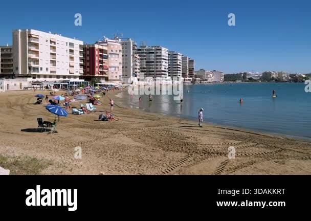 Torrevieja, Spain-October 2, 2024: People relaxing on the beach of ...