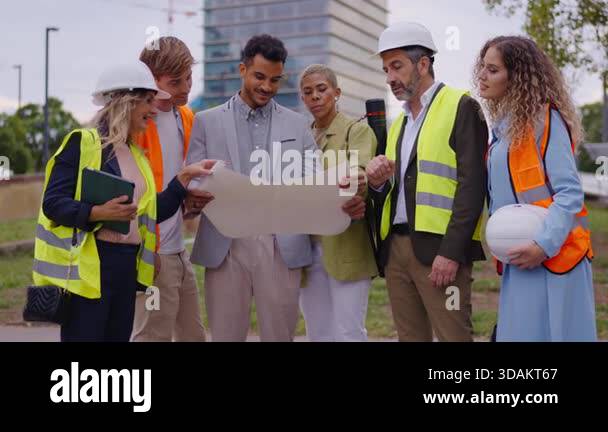 Multiracial group of construction managers and architects analyzing ...
