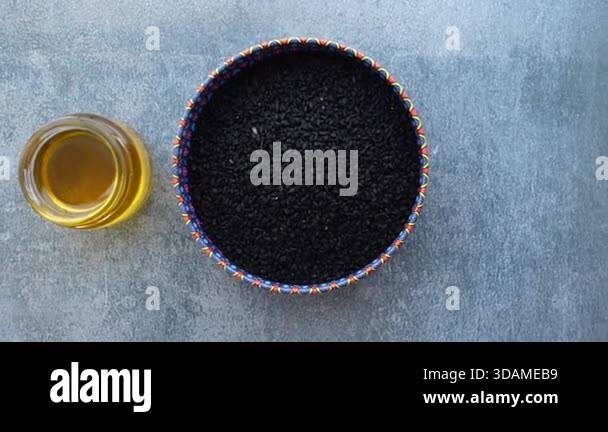 How to use black cumin seeds and oil for health benefits Stock Video ...