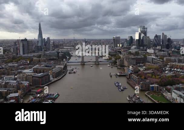 Aerial drone video of Tower Bridge in downtown London, capturing the ...