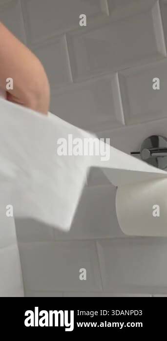 Toilet paper being used and running out symbolizing economy and ...