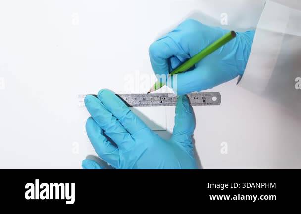 A scientist measures and marks the origin line on a Thin Layer ...