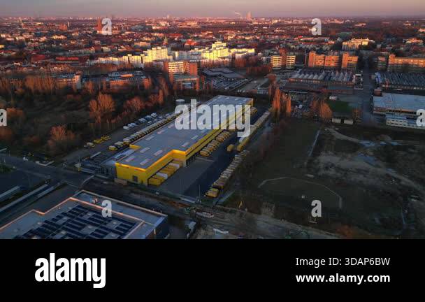 Aerial view of a large DHL Deutsche Post logistics center with numerous ...