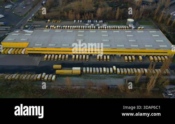 Aerial view of a large DHL Deutsche Post logistics center with numerous ...