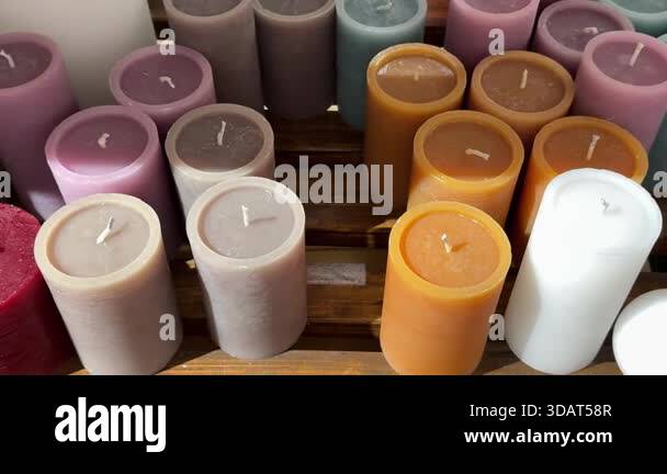 Colorful collection of candles, presented both individually and in ...