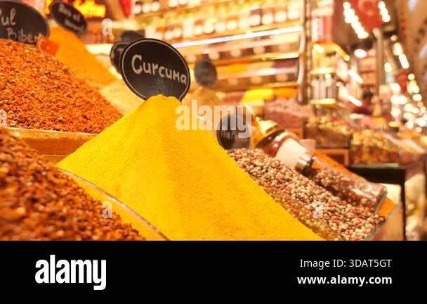 A visit to a spice market shows large piles of spices and herbs Stock ...