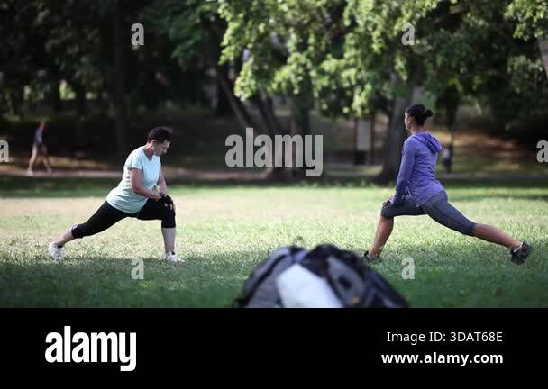 Women stretching legs on grass Stock Videos & Footage - HD and 4K Video ...