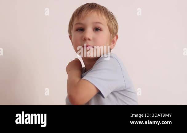 Cute little boy making different funny faces and expressing various ...