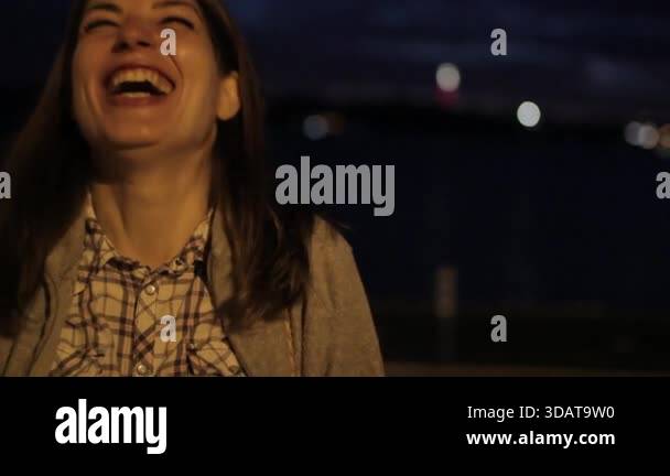 Portrait of a beautiful young woman laughing and changing facial ...