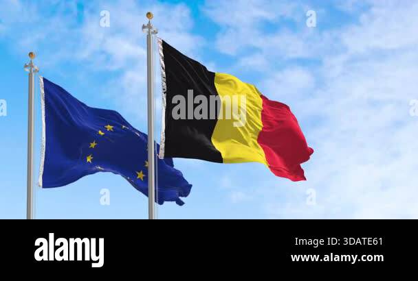 Belgium and European Union flags waving together on a clear day ...