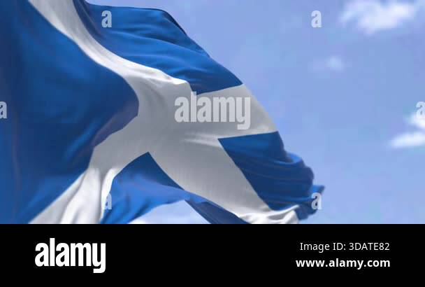 The flag of Scotland waving in the wind on a clear day. White Saint ...