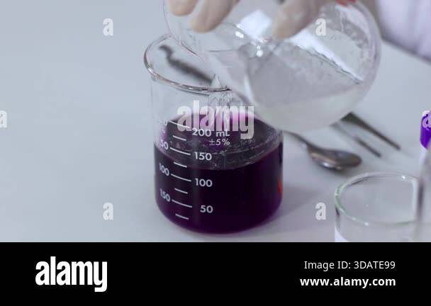 Color-changing chemical reaction in a laboratory setting Stock Video ...