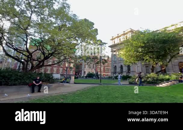 People enjoying the library's outdoor space Stock Video Footage - Alamy