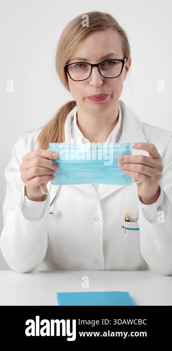 Doctor demonstrates how to wear a face mask correctly for safety and ...