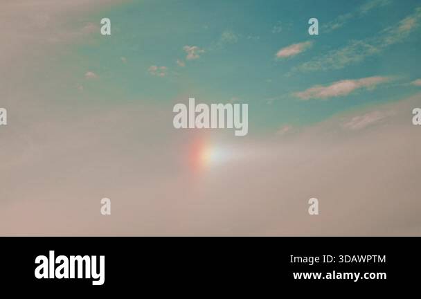 A subtle, soft sky with a faint vertical rainbow or sundog, blending ...