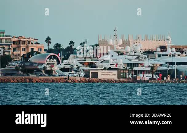 Cannes, France - November 18, 2025: A marina filled with yachts, with a ...