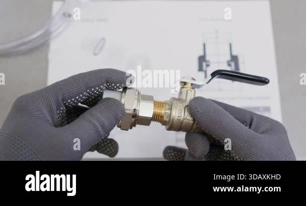 Plumber threads coupling onto valve nipple keeping pitch aligned ...