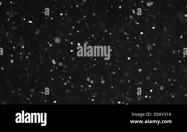 A gentle winter scene with soft snowflakes falling on black background ...