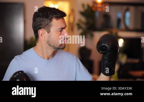 man doing boxing exercises in the living room Stock Video Footage - Alamy