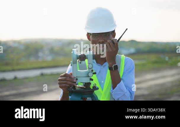 African american surveyor engineer using a theodolite for land ...