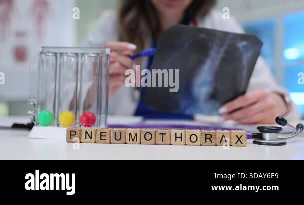 Wooden blocks spell word Pneumothorax near spirometer and x-ray film ...