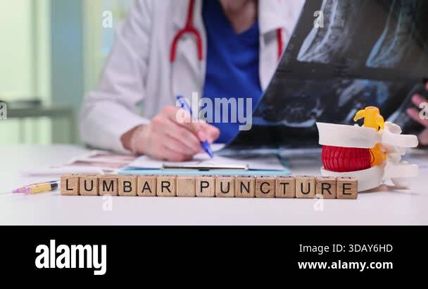 Lumbar Puncture phrase on wooden cubes and doctor holds x-ray images in ...