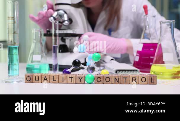 Laboratory technician carefully examines sample under microscope ...