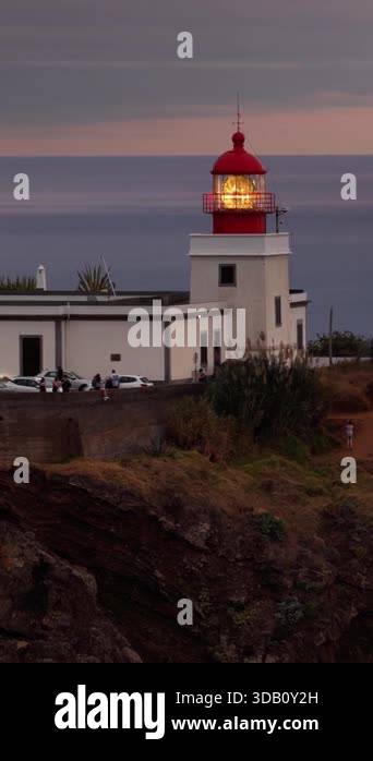 Light beams from the Ponta do Pargo Lighthouse. Dusk approaches in ...